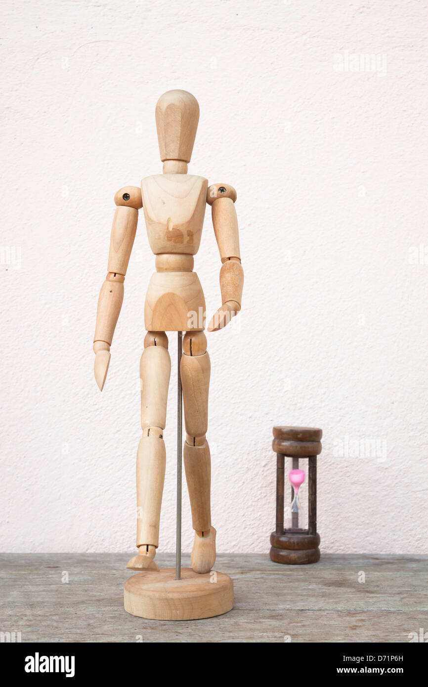 Wooden mannequin pose in concept of progress time Stock Photo - Alamy