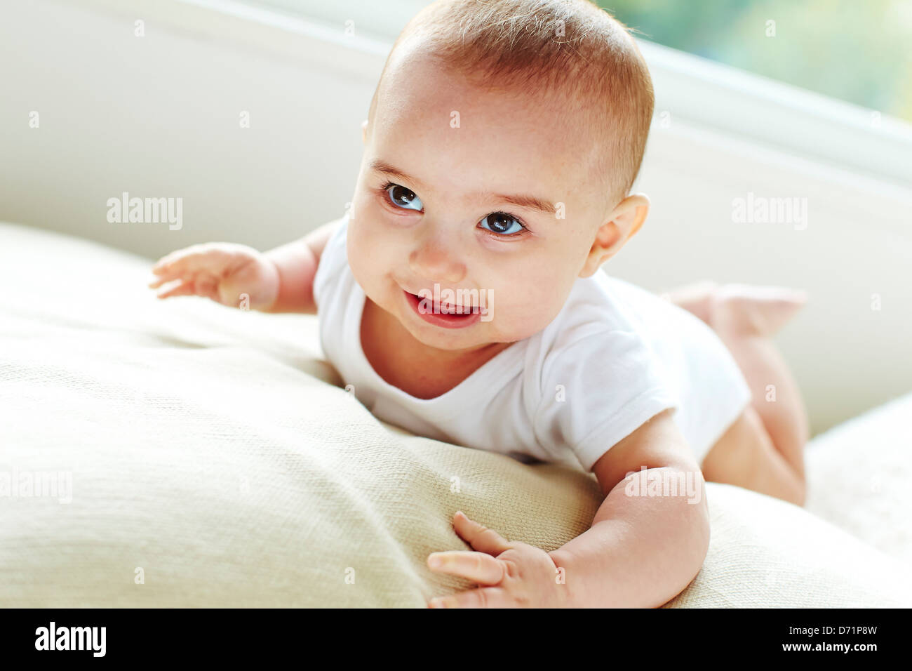 Baby laid on front hi-res stock photography and images - Alamy