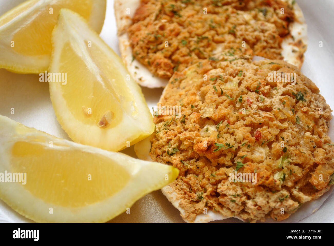 Appetizer of Stuffed Scallop Shells with Lemon Slices Stock Photo - Alamy