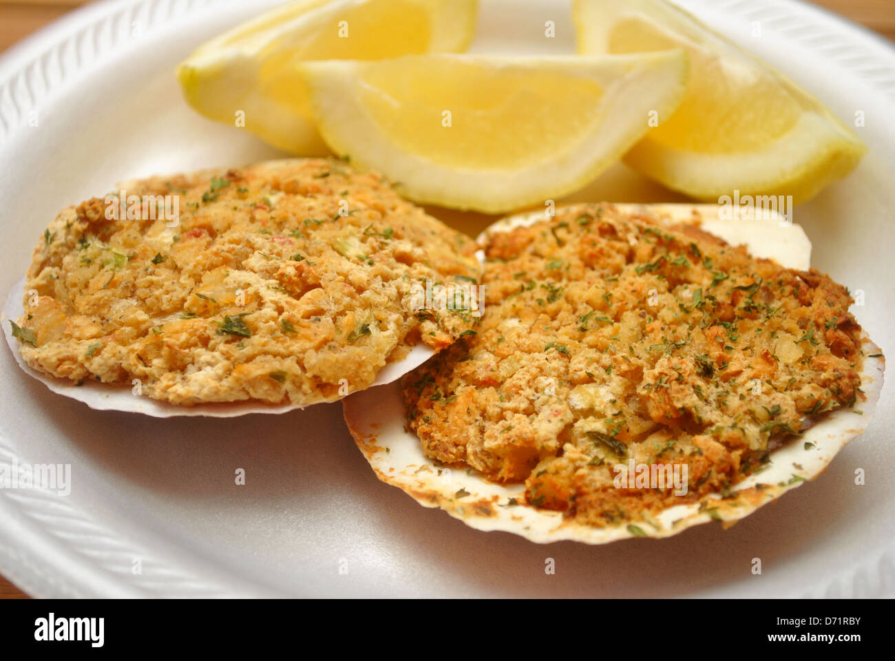 Lemons with Gourmet Stuffed Scallops Stock Photo - Alamy