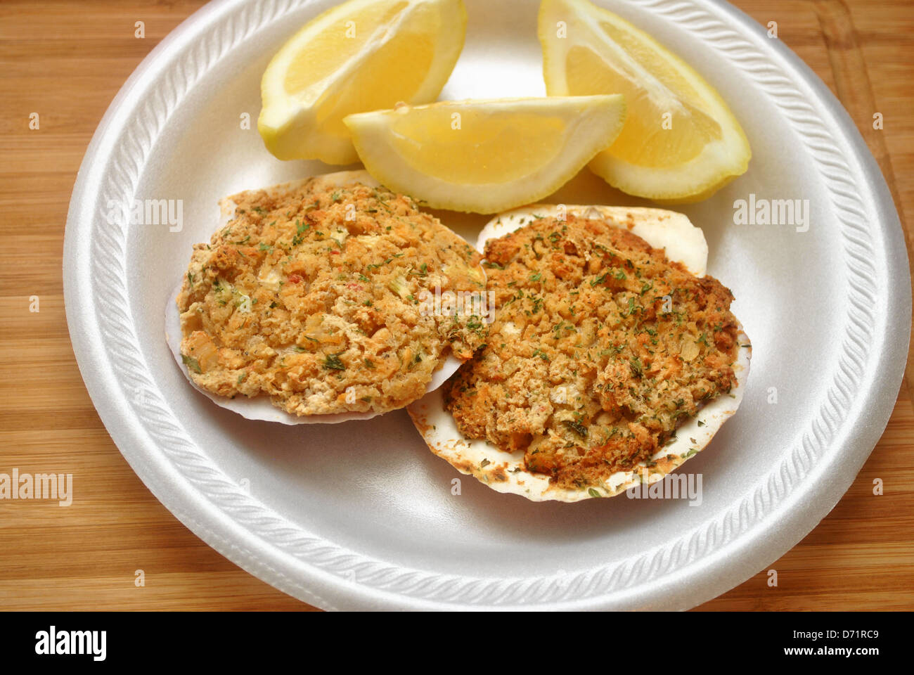 Two Stuffed Scallops with Three Lemon Slices Stock Photo - Alamy