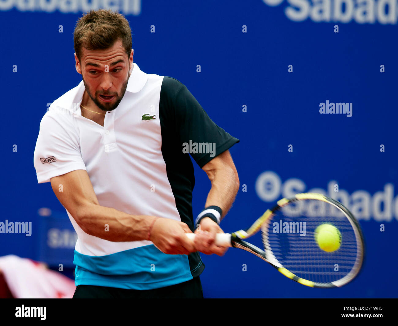 Barcelona, Spain. 26th April 2013. Benoit Paire of France plays a double handed backhand to ...