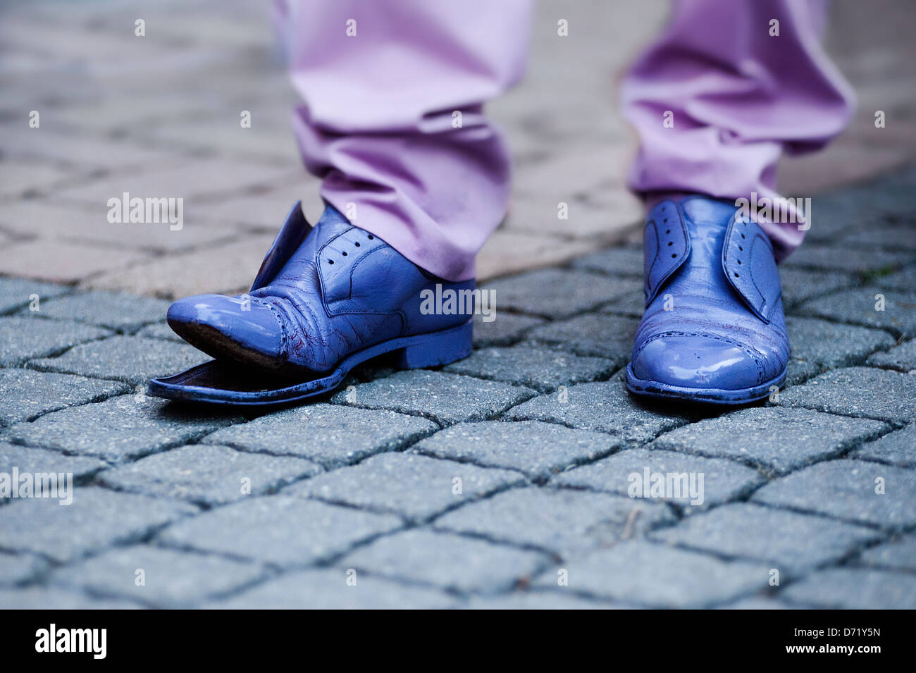 tattered and damaged male eccentric shoes Stock Photo - Alamy