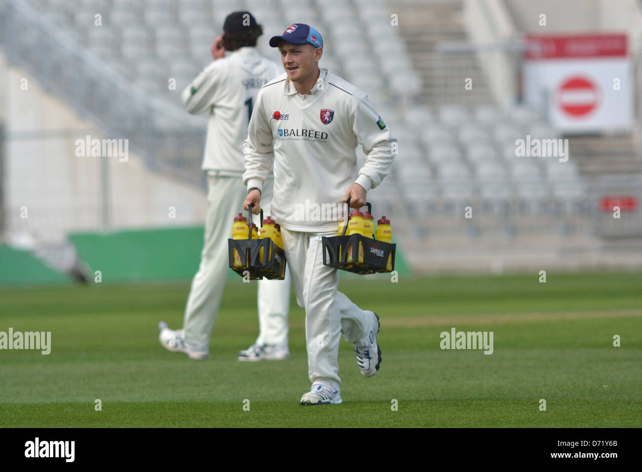 The Kent twelfth man, Ashley Shaw, carries drinks at a match between ...