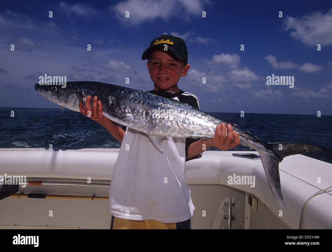 A young boy with a King Mackerel (Scomberomorus cavalla) caught near ...