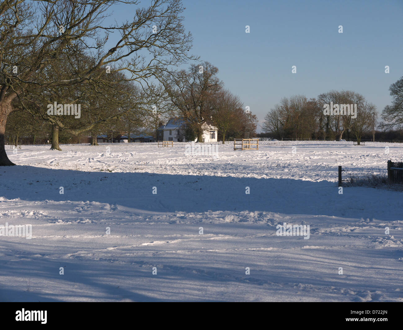 Snowy scene across fields Stock Photo - Alamy