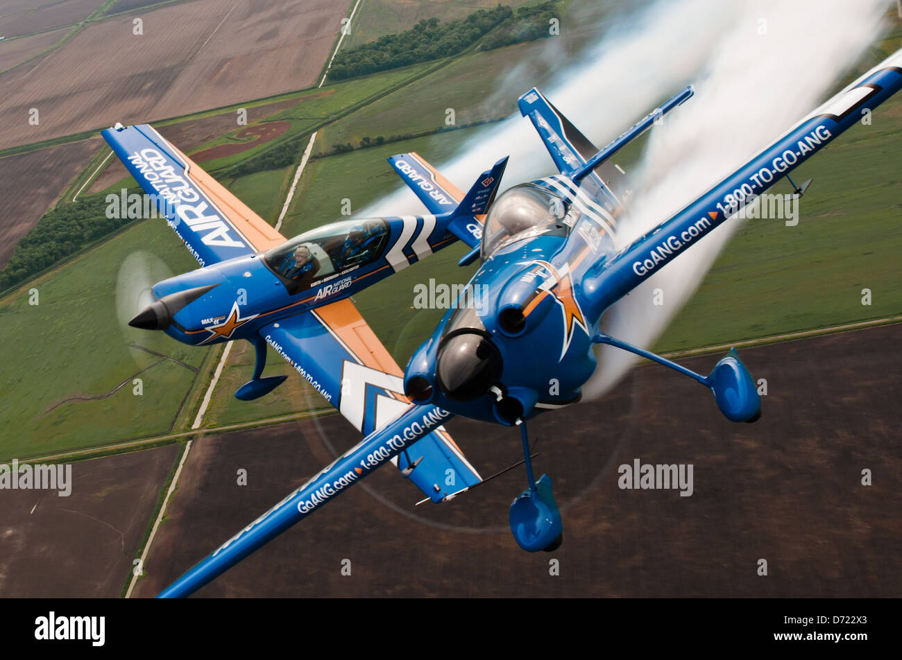 An aerobatic display aircraft performs a high-performance maneuver ...