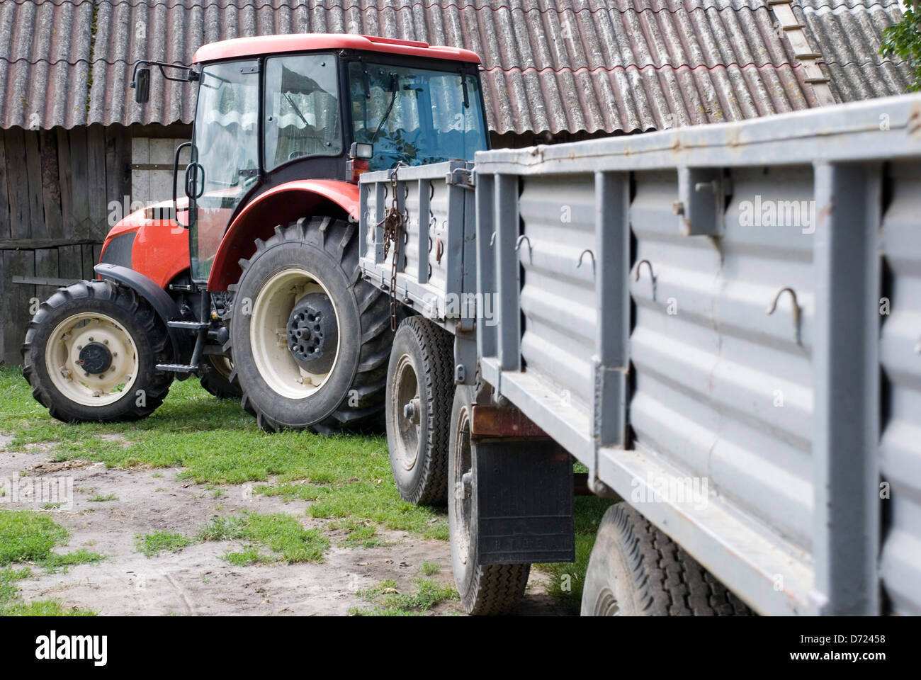Tractor and trailer on a farm in Poland Stock Photo - Alamy