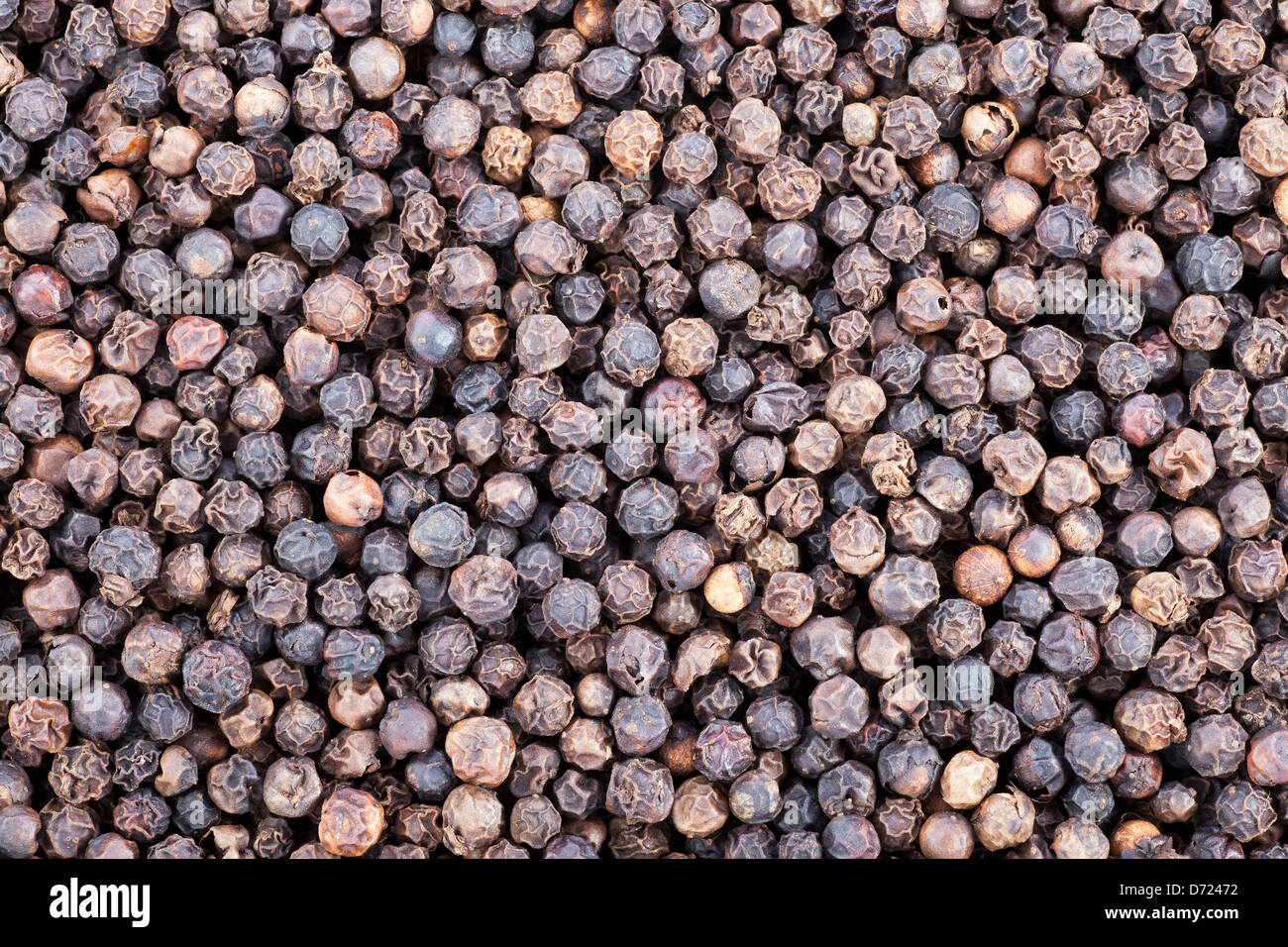 Black peppercorns food texture background Stock Photo - Alamy