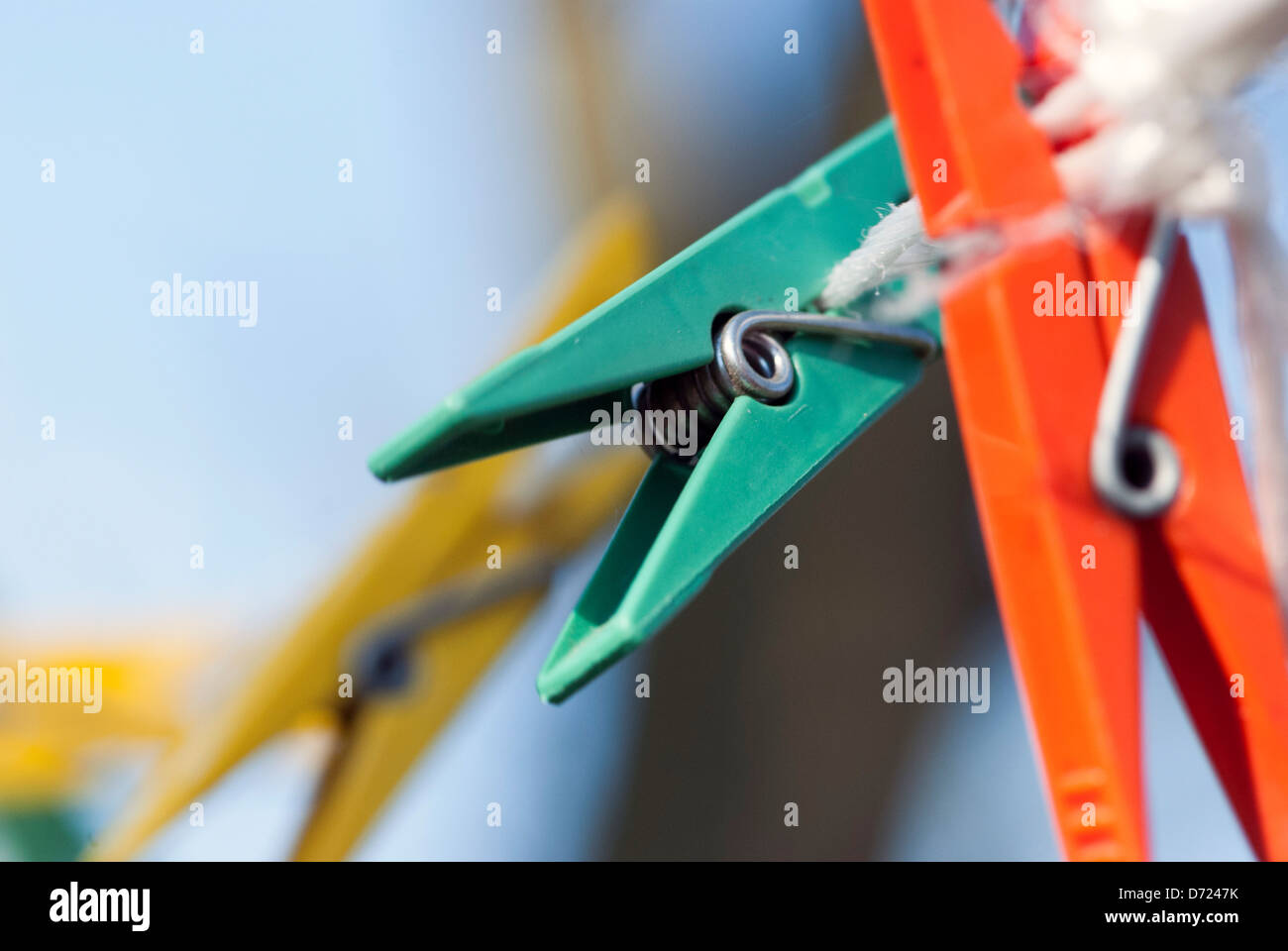 Close up of brightly colored clothes pegs Stock Photo - Alamy