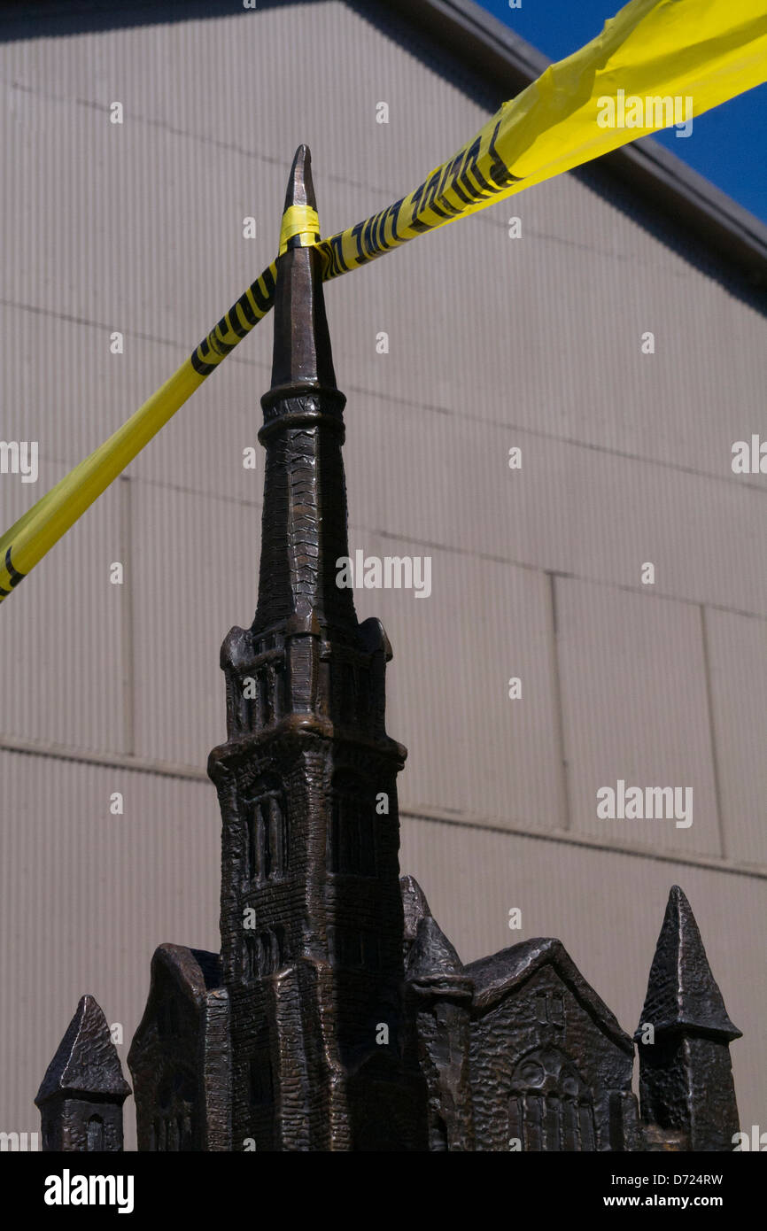 yellow police tape wrapped around and across objects. knotted and ...