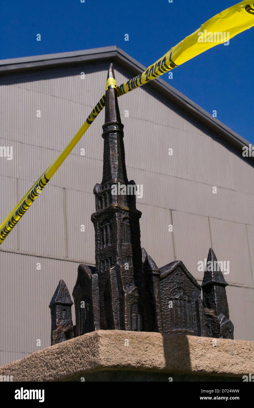 yellow police tape wrapped around and across objects. knotted and ...