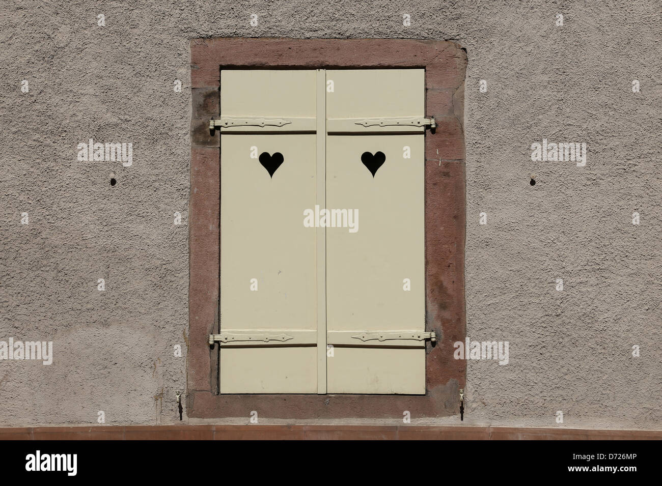 Window with closed shutters with heart shaped decor Stock Photo - Alamy