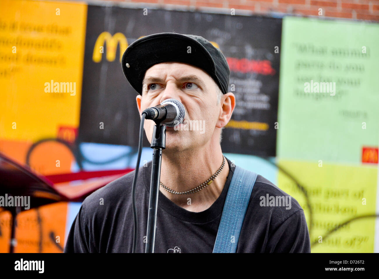 man playing some rock music and singing Stock Photo - Alamy