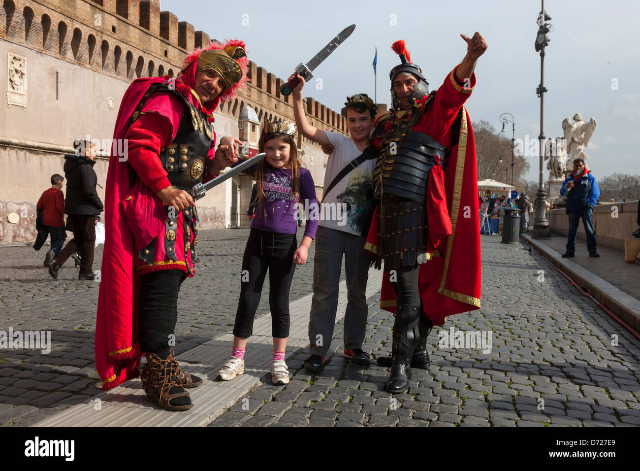 Posing with men dressed as Roman soldiers outside the castle, Rome ...