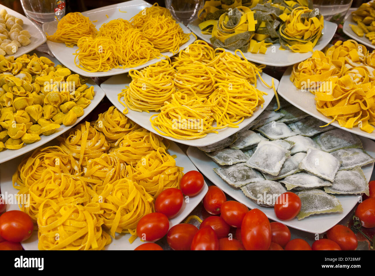Pasta and tomatoes in the window of a restaurant in Rome, Italy Stock ...