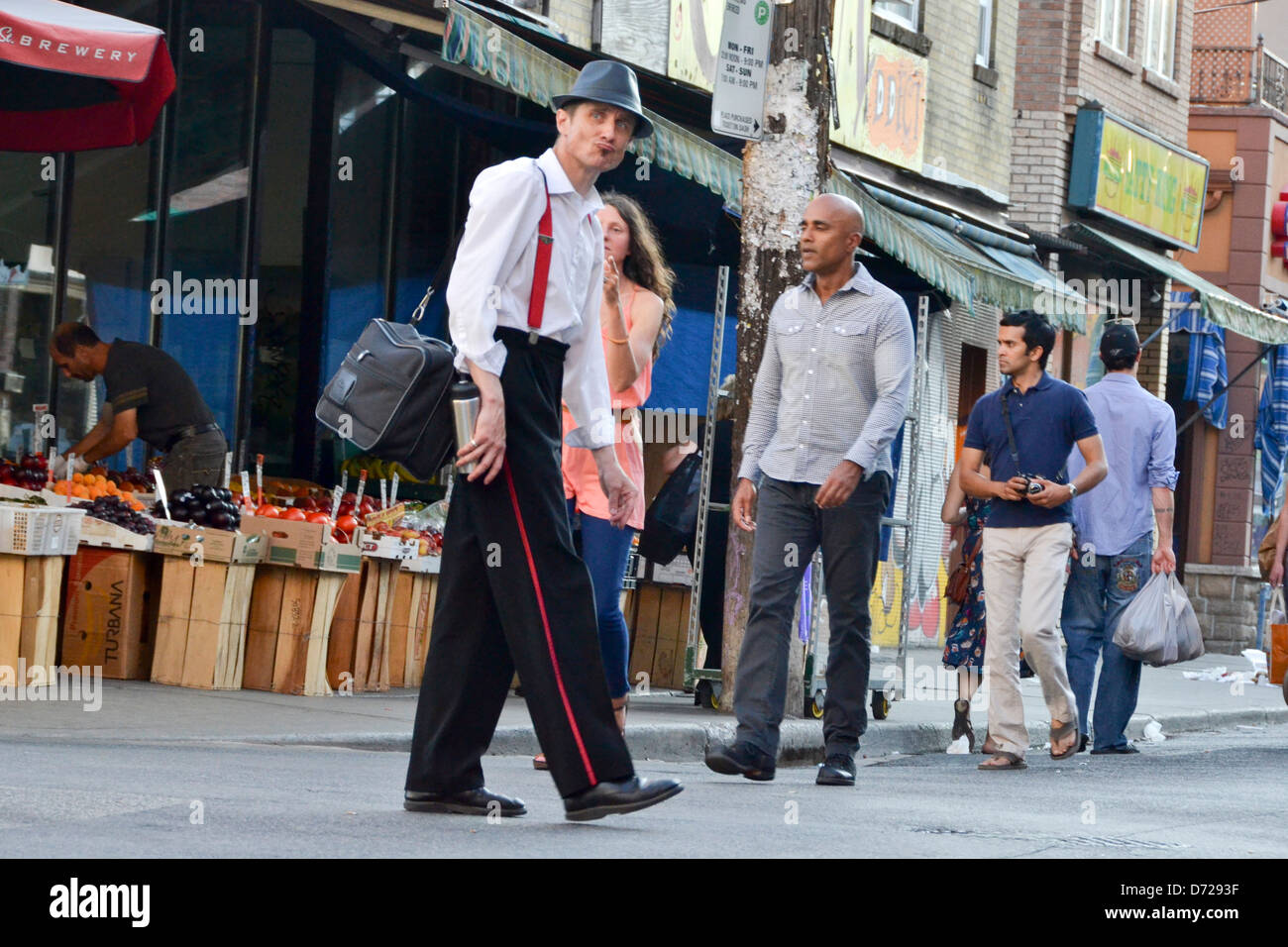 a guy walking on the streets of toronto Stock Photo - Alamy