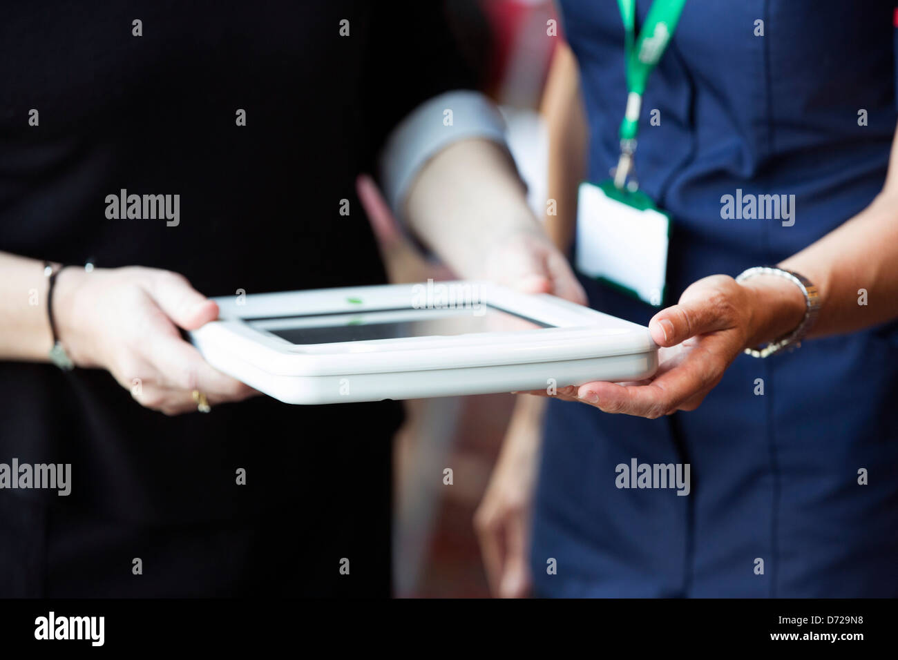 nurse using apple ipad in protective case Stock Photo - Alamy