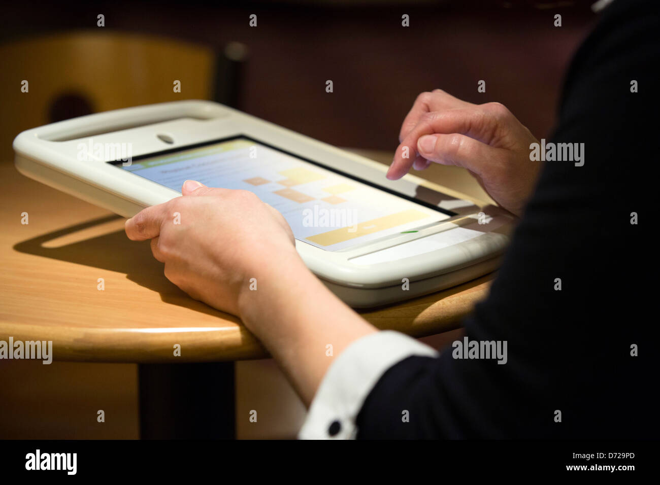 nurse using apple ipad in protective case Stock Photo - Alamy