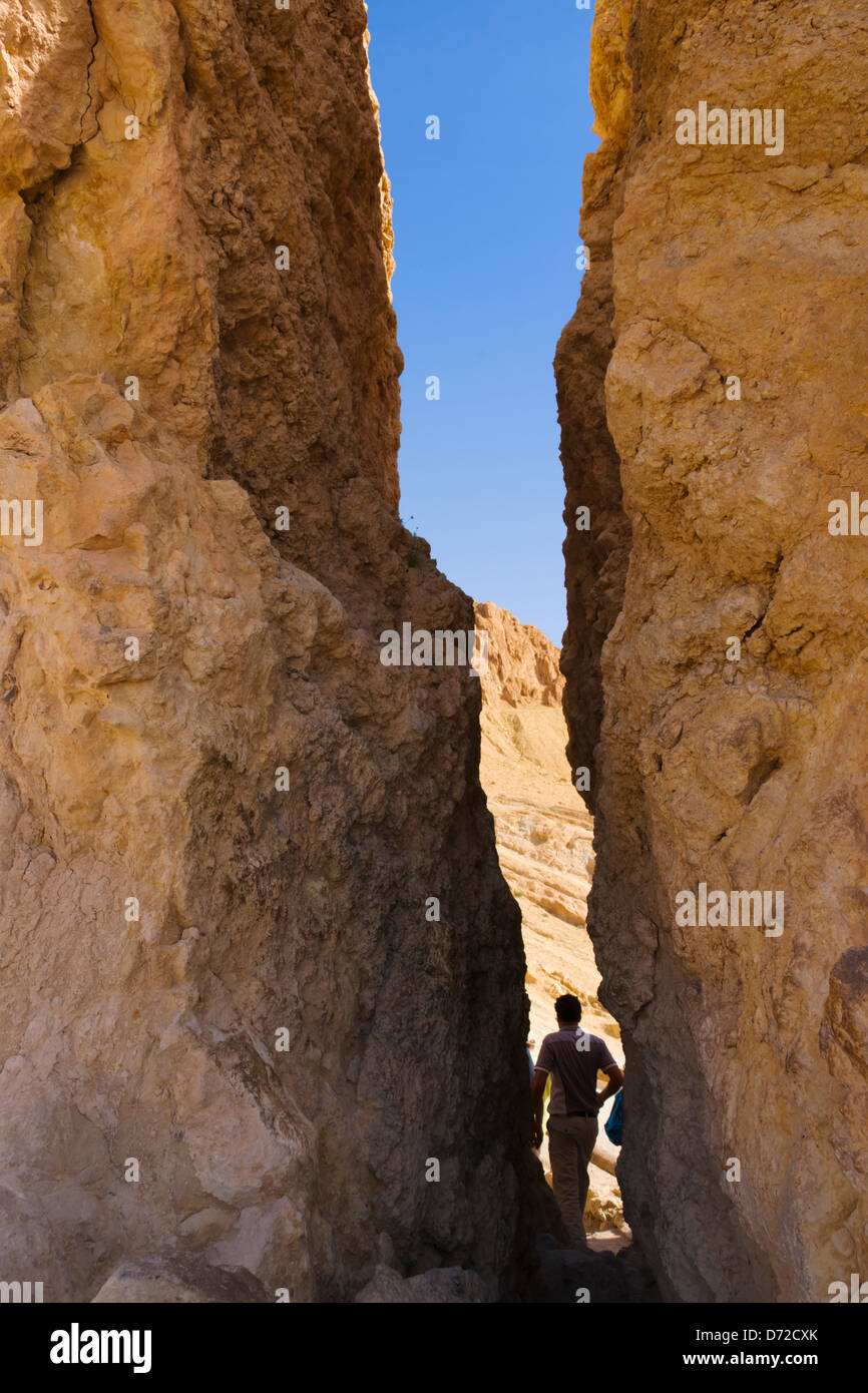 Tourist hiking in Chebika Gorge in Atlas-Sahara Mountain, near Tozeur ...