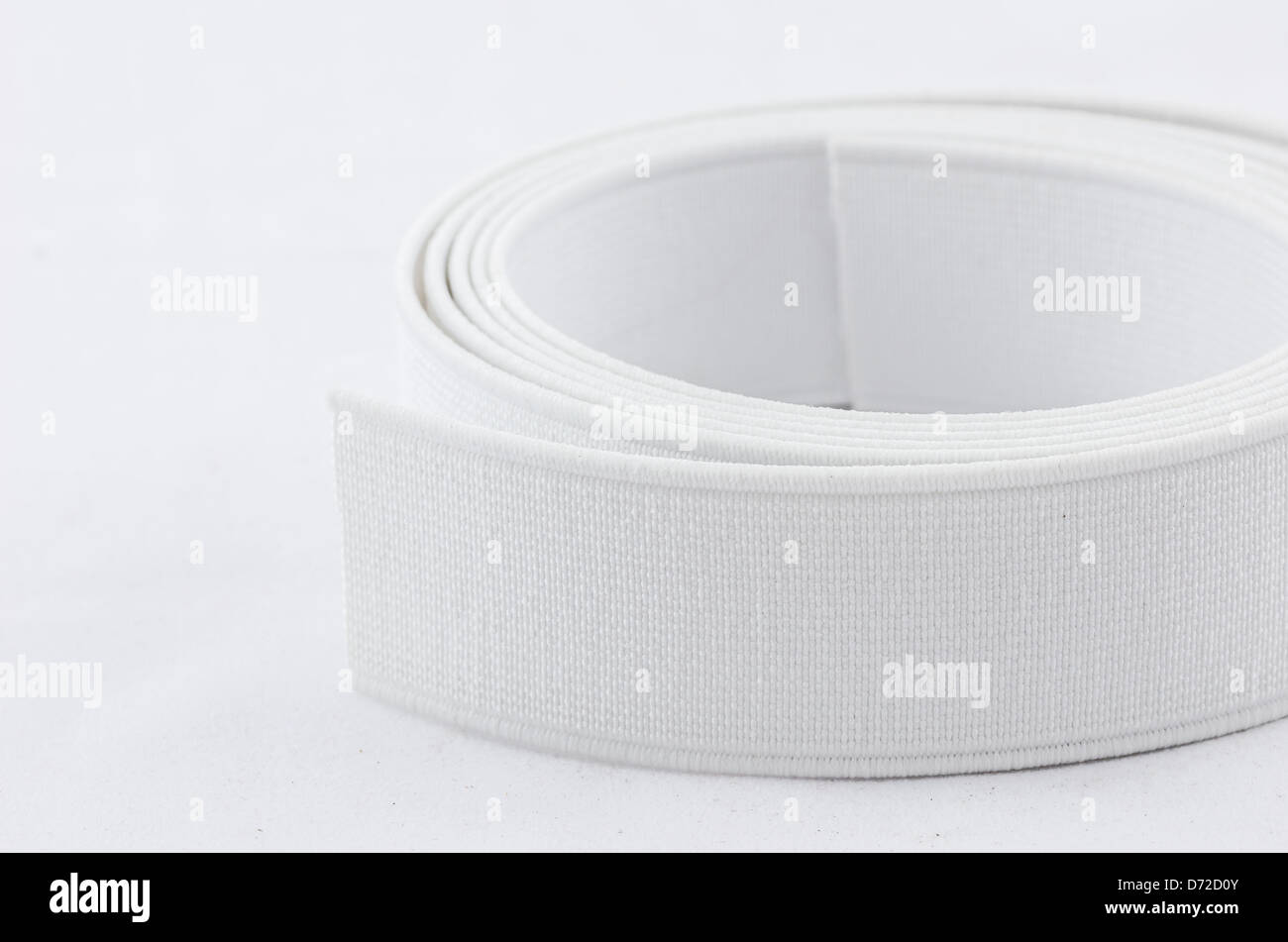 Elastic strips for cloth in the white background Stock Photo - Alamy