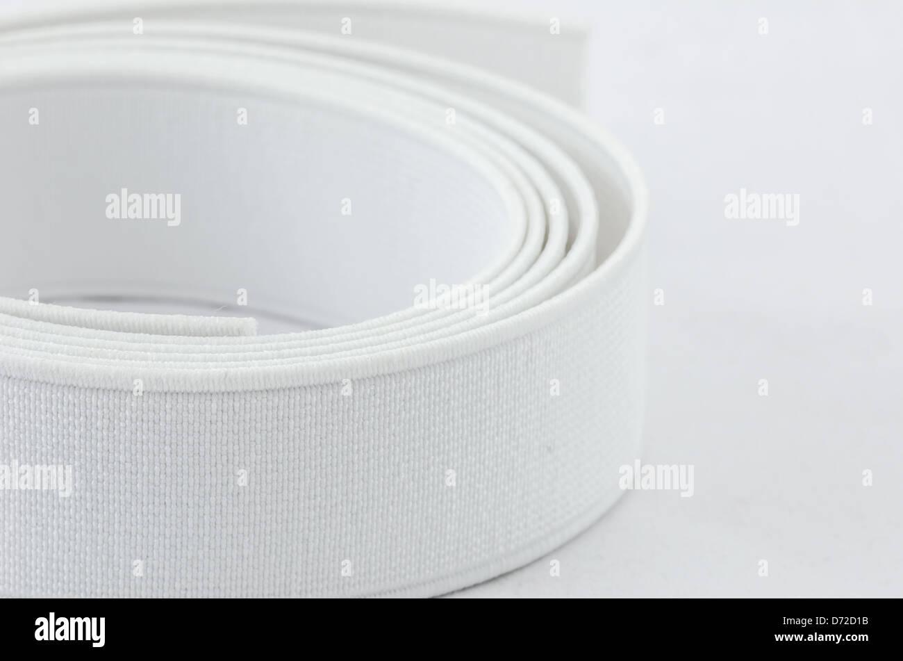 Elastic strips for cloth in the white background Stock Photo - Alamy