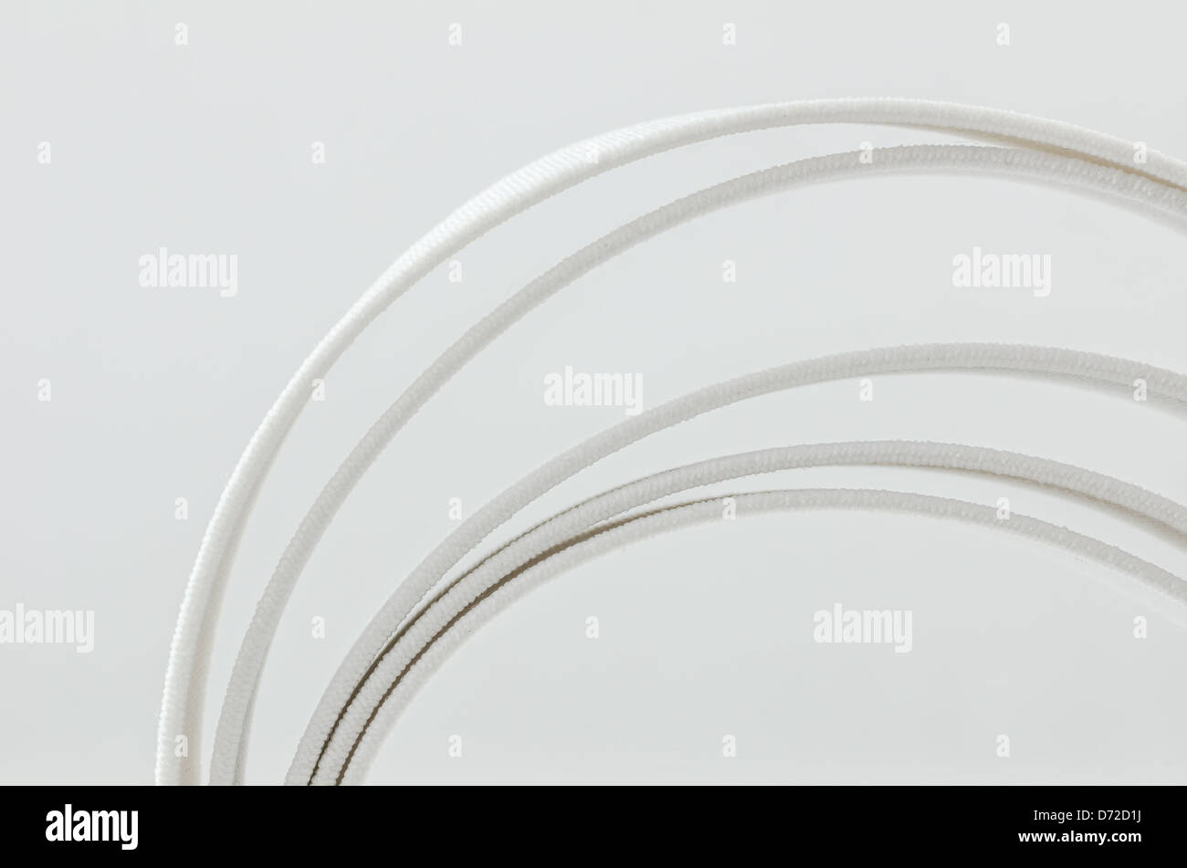 Elastic strips for cloth in the white background Stock Photo - Alamy