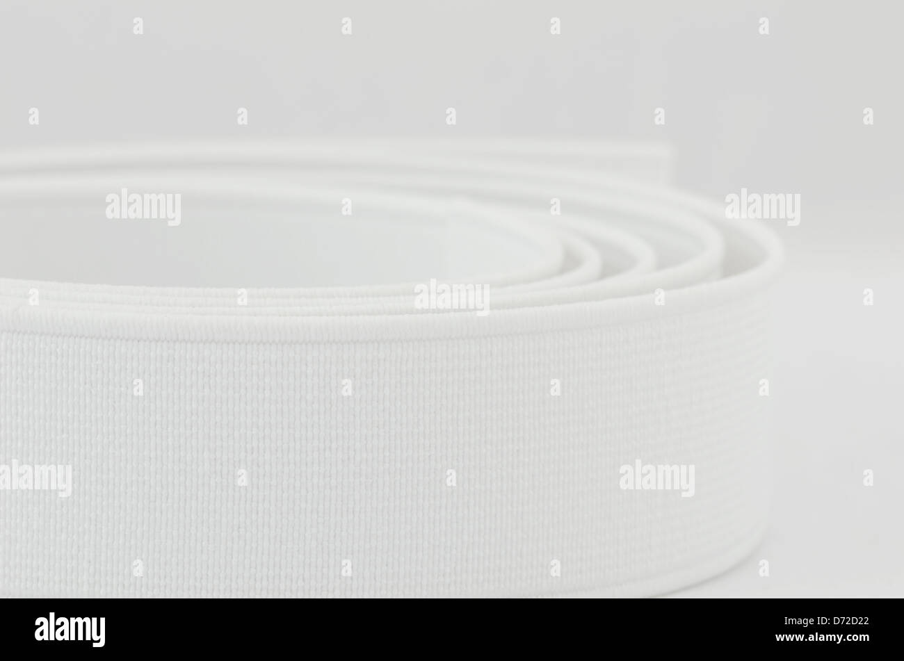 Elastic strips for cloth in the white background Stock Photo - Alamy