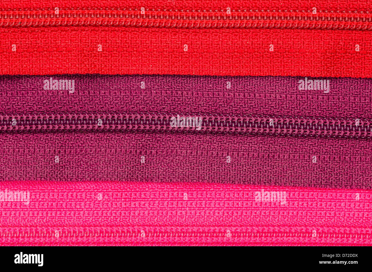 Zipper colorful red violet pink hot tone background Stock Photo - Alamy