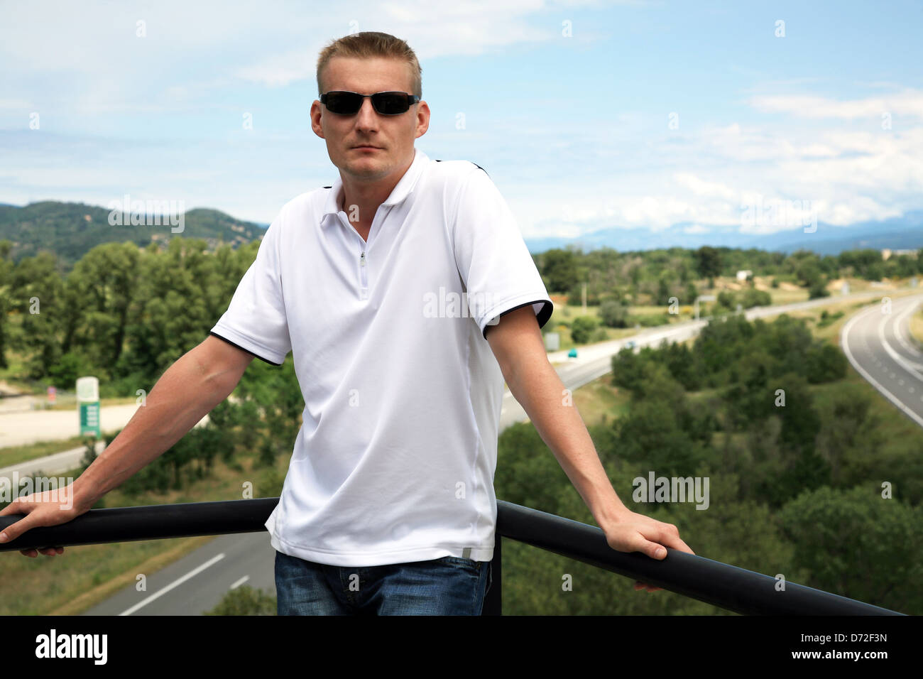 Handsome blond man on scenic highway background in France Stock Photo ...