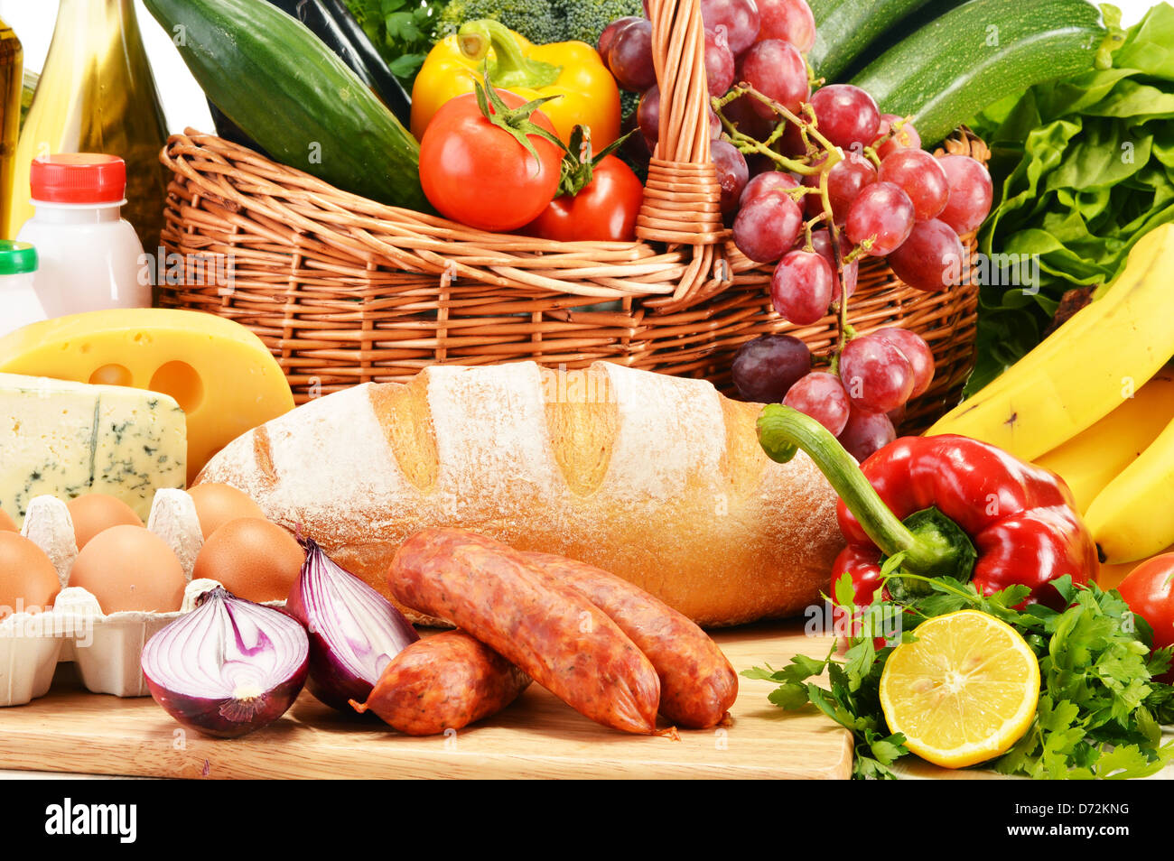 Assorted grocery products including vegetables fruits wine bread dairy ...
