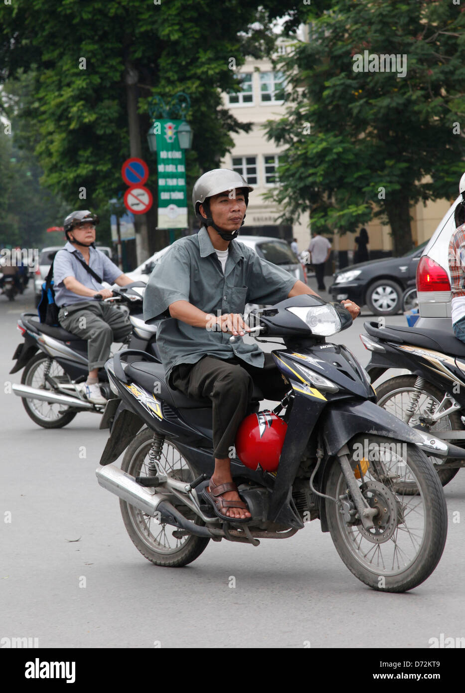Hanoi, Vietnam, moped riders on the road Stock Photo - Alamy