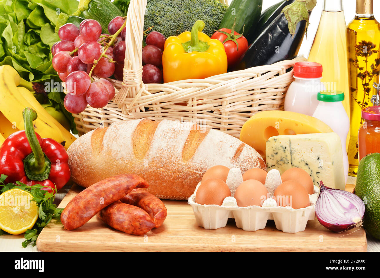 Assorted grocery products including vegetables fruits wine bread dairy ...