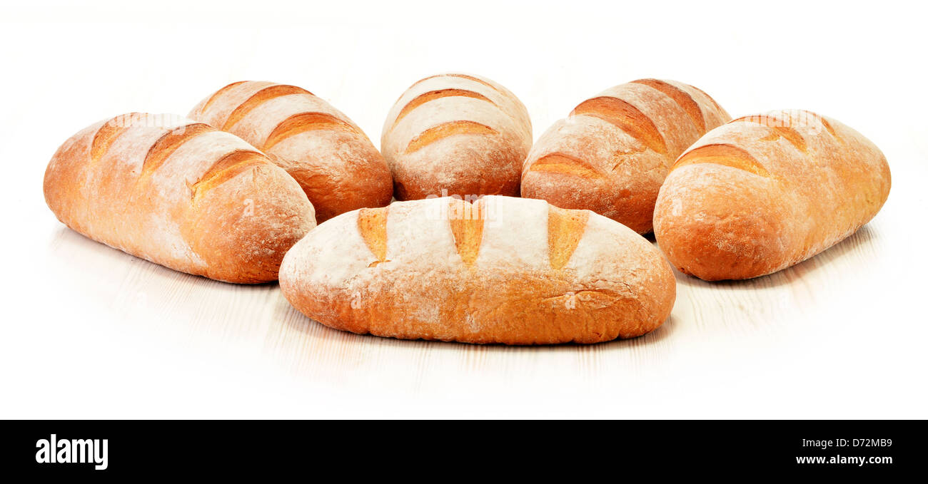 Composition with loafs of bread isolated on white Stock Photo - Alamy