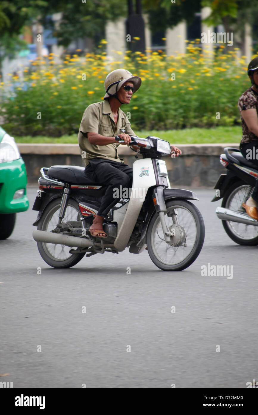 Ho Chi Minh City, Vietnam, moped drivers on the road Stock Photo - Alamy