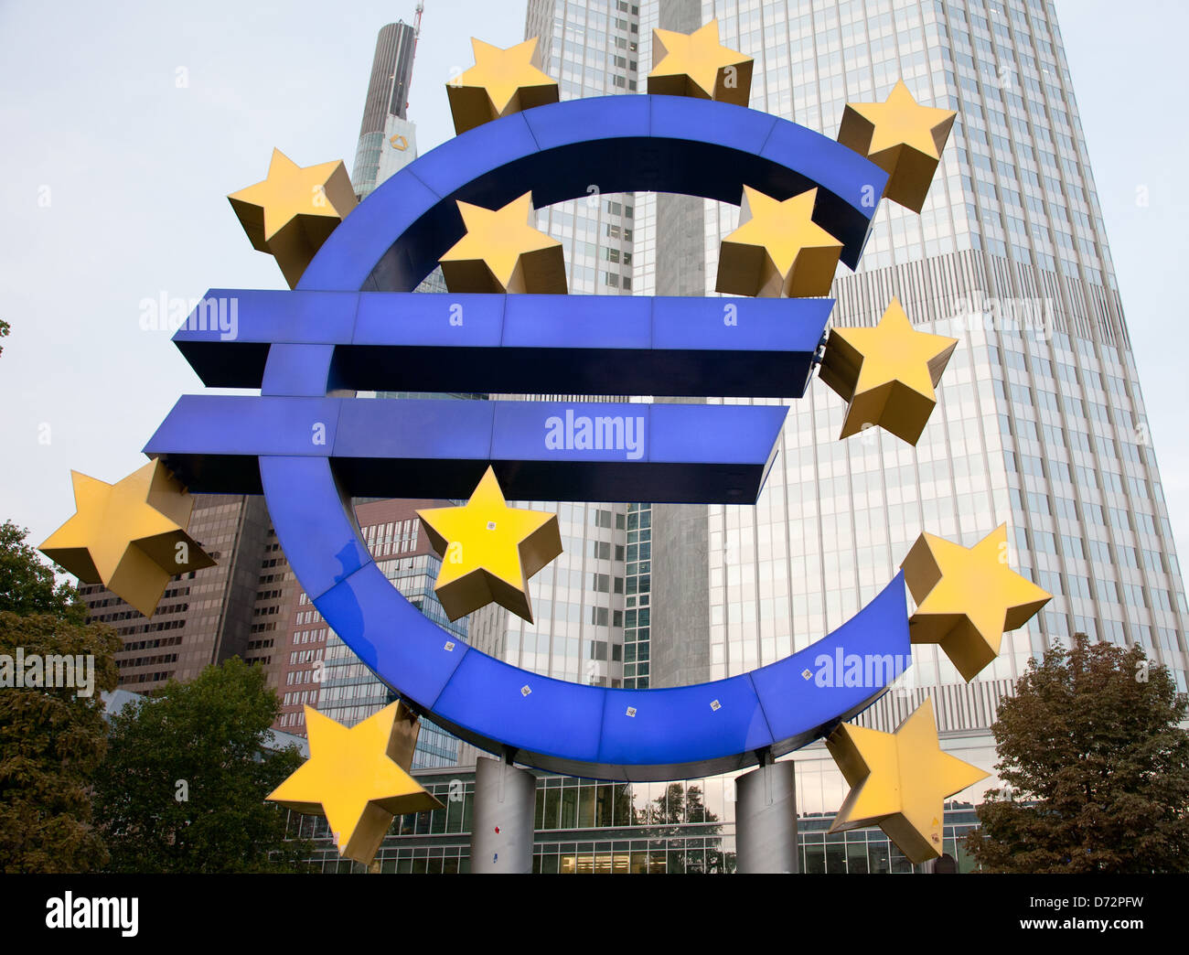 Frankfurt, Germany, the Euro sculpture in front of the Tower of the ECB ...