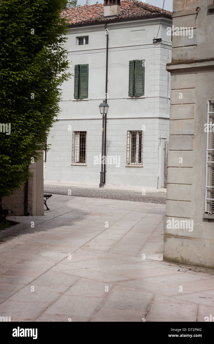 Partial view of an old empty street with a house at the bottom Stock ...