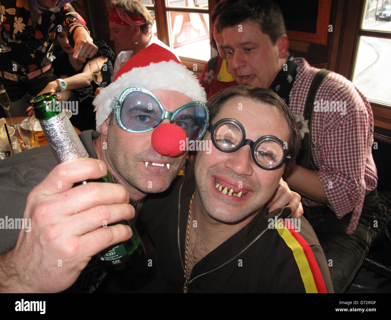 Riedlingen, Germany, two men celebrating the Carnival in the pub Stock ...