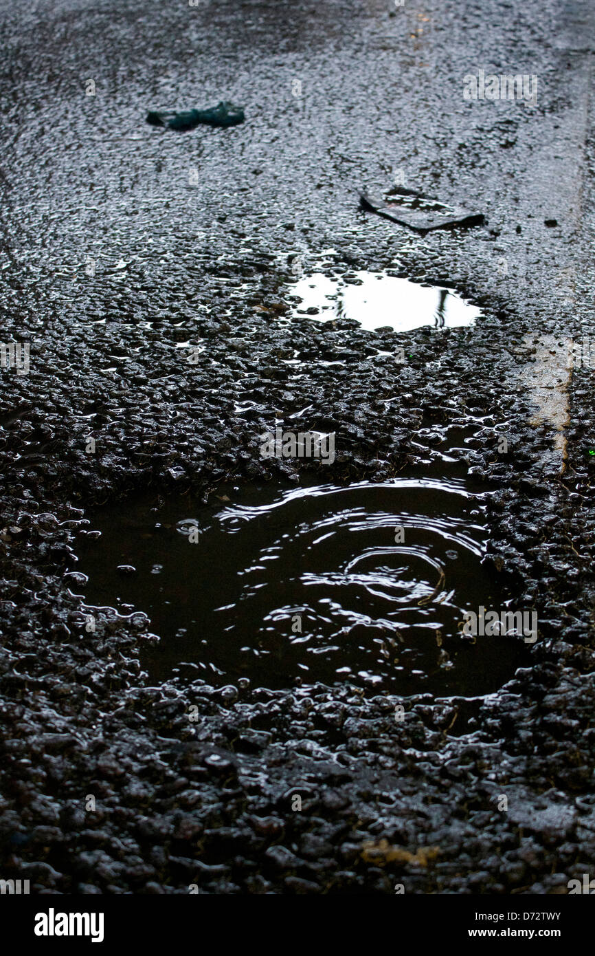 Puddle splashes in a darkened tunnel London Stock Photo - Alamy