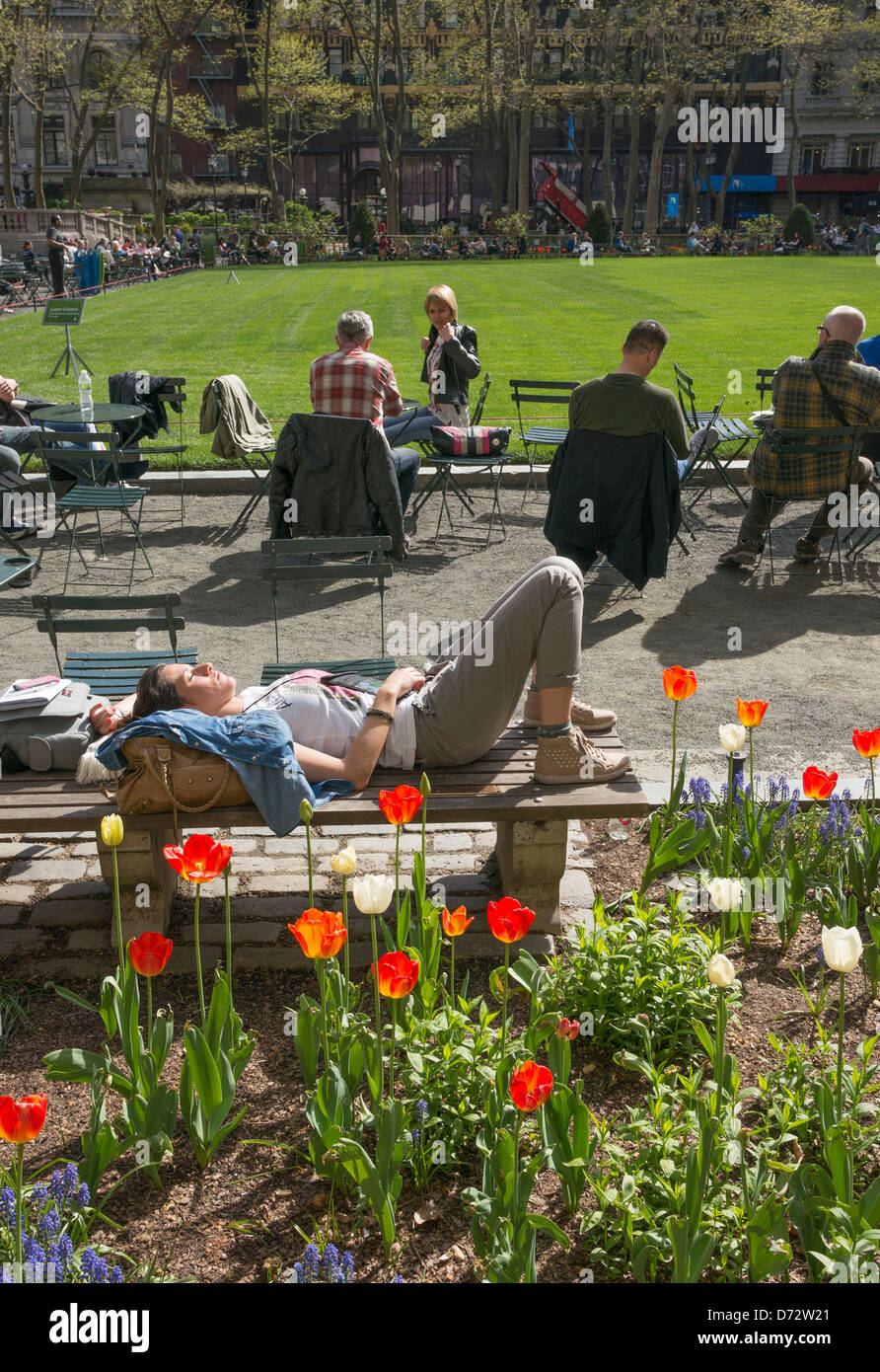 A young woman taking the sun in Bryan Park in New York City Stock Photo ...