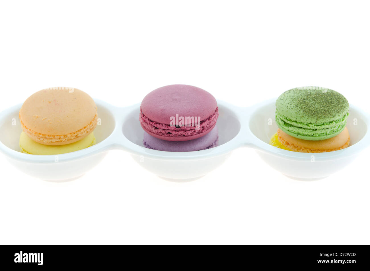 French macaroons stack in bowl over white background Stock Photo - Alamy