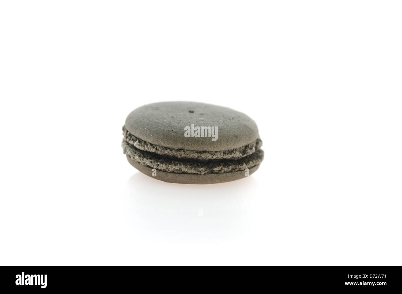 black french macaroons over white background . single dessert Stock ...