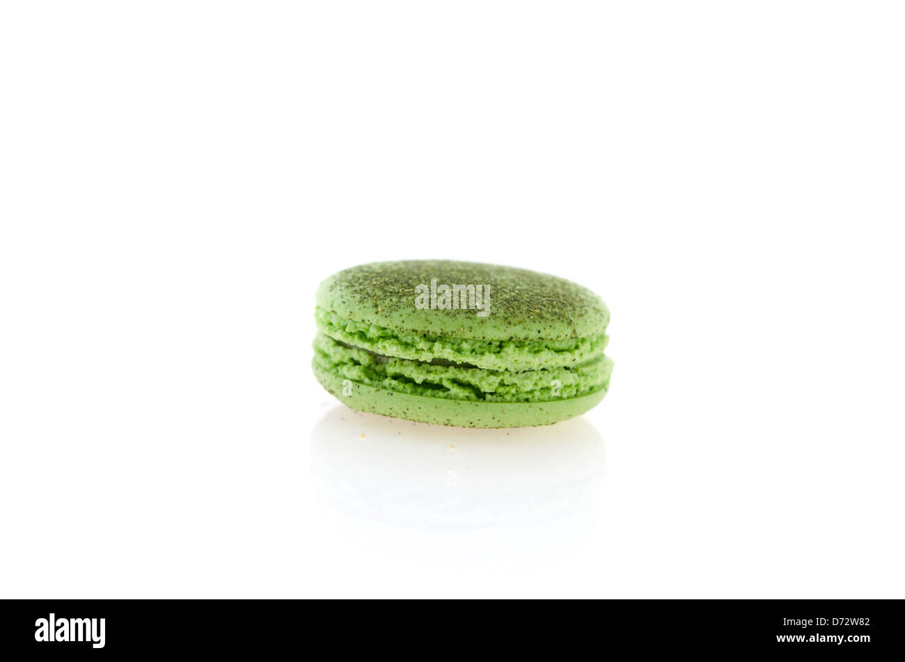 green french macaroons over white background , single dessert Stock ...