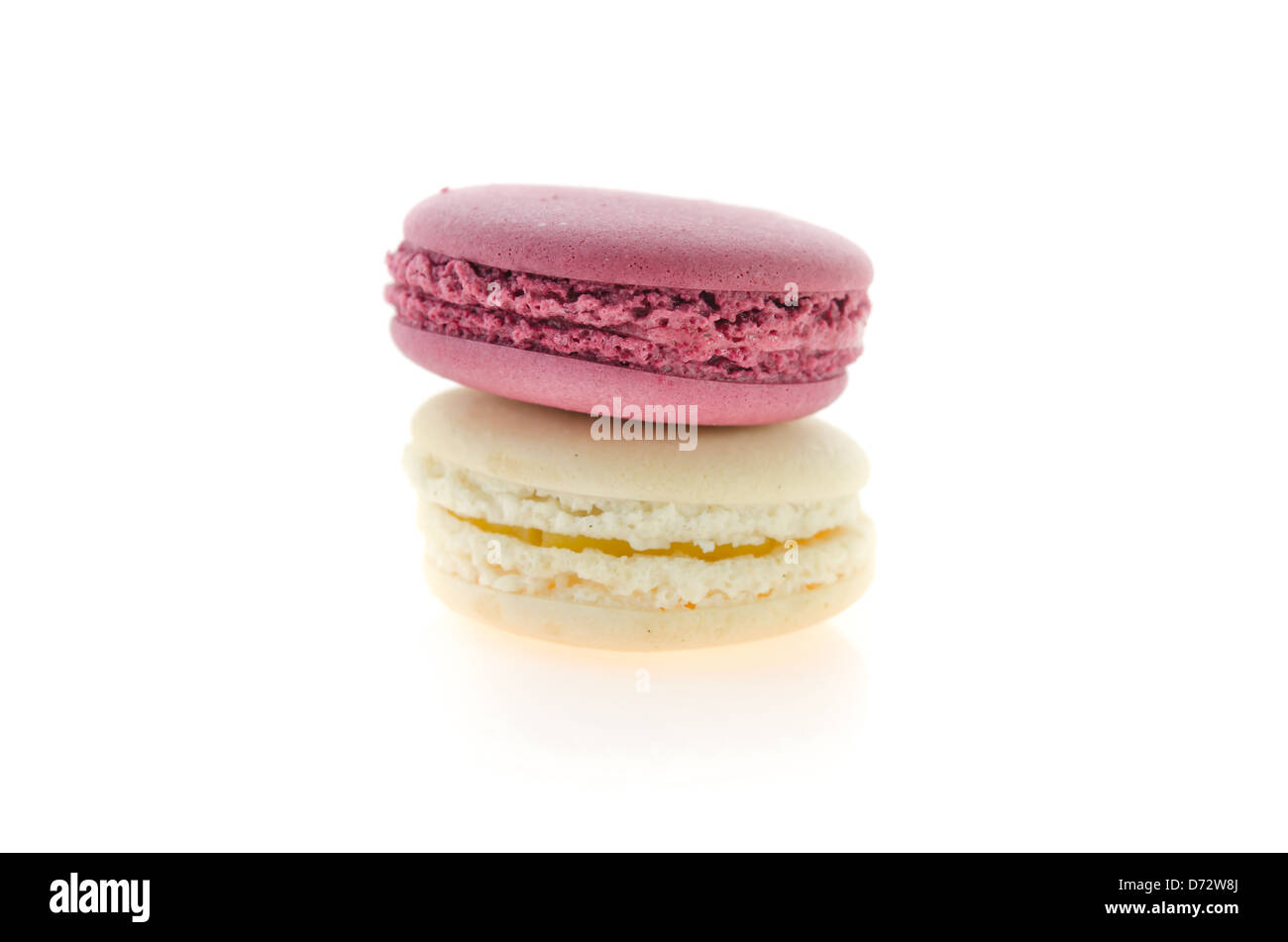 french macaroons in pink and cream stack on white background Stock ...