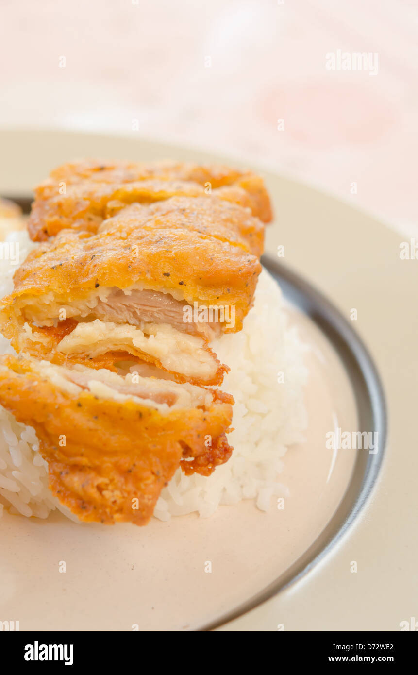 fresh fried Chicken over steamed rice on plate Stock Photo - Alamy