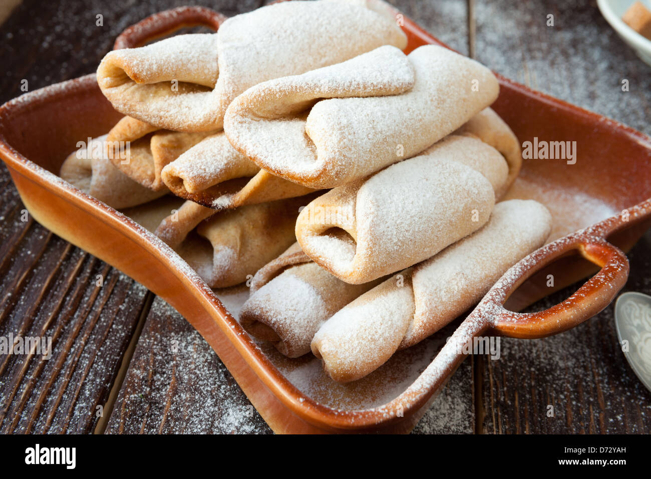 French sugar buns sprinkled with powdered sugar, closeup Stock Photo ...