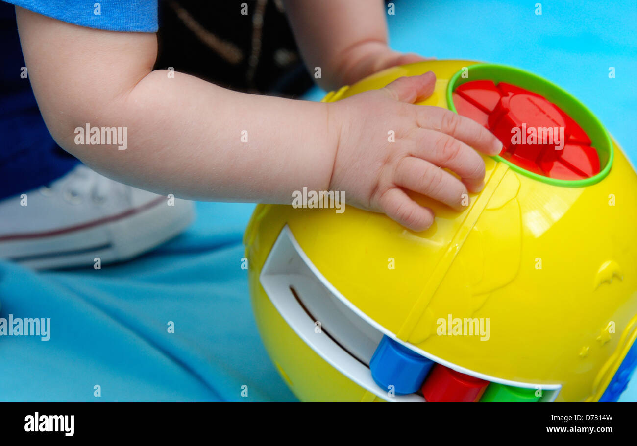Child grabbing toy hi-res stock photography and images - Alamy