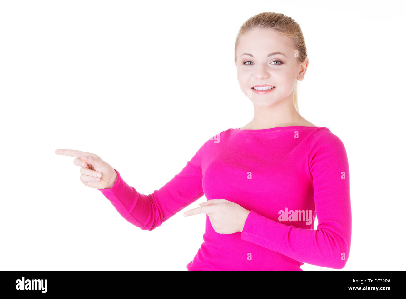 Happy , excited young woman pointing on copy space, isolated on white ...