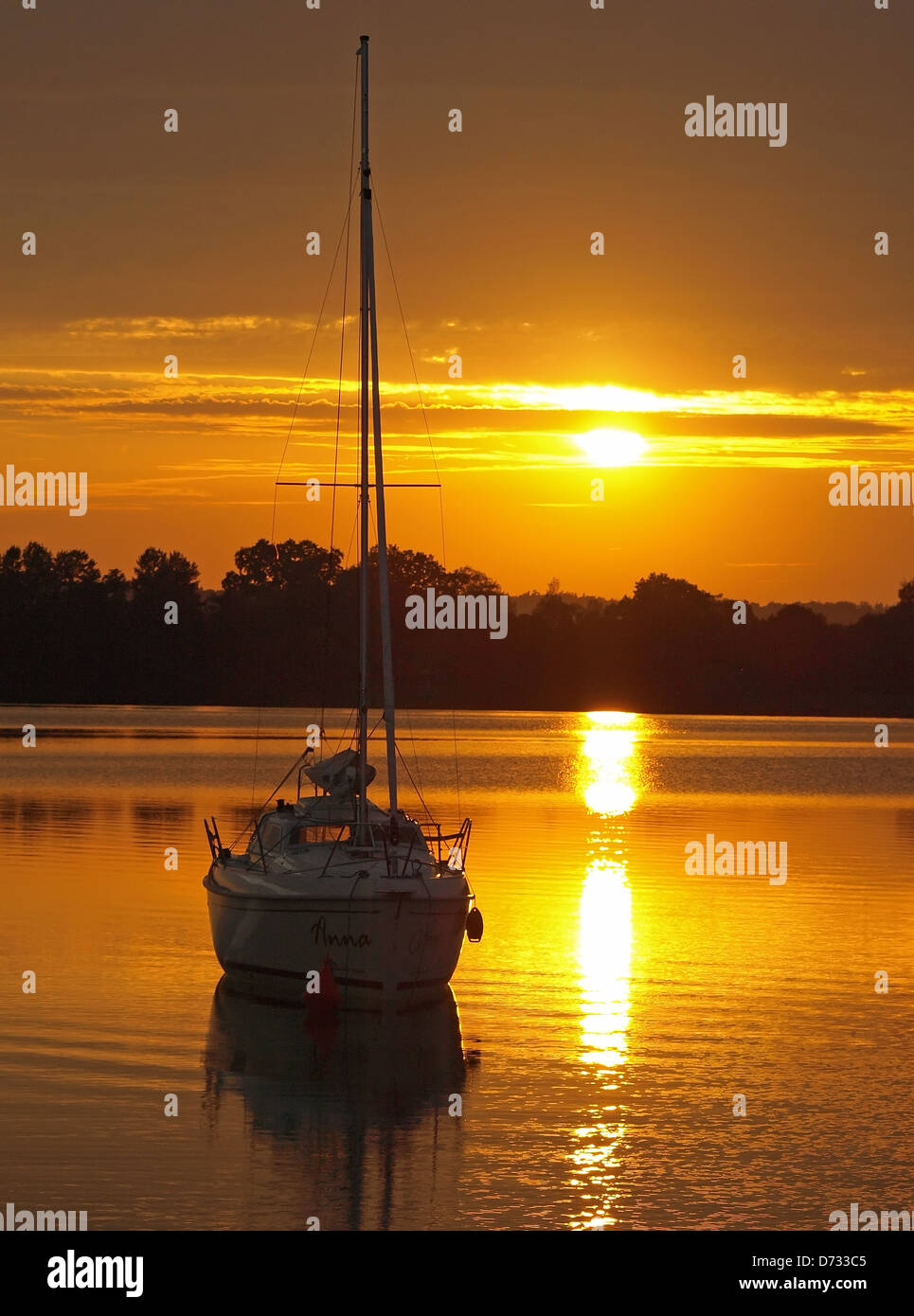 sailboat on the sunset lake Stock Photo - Alamy