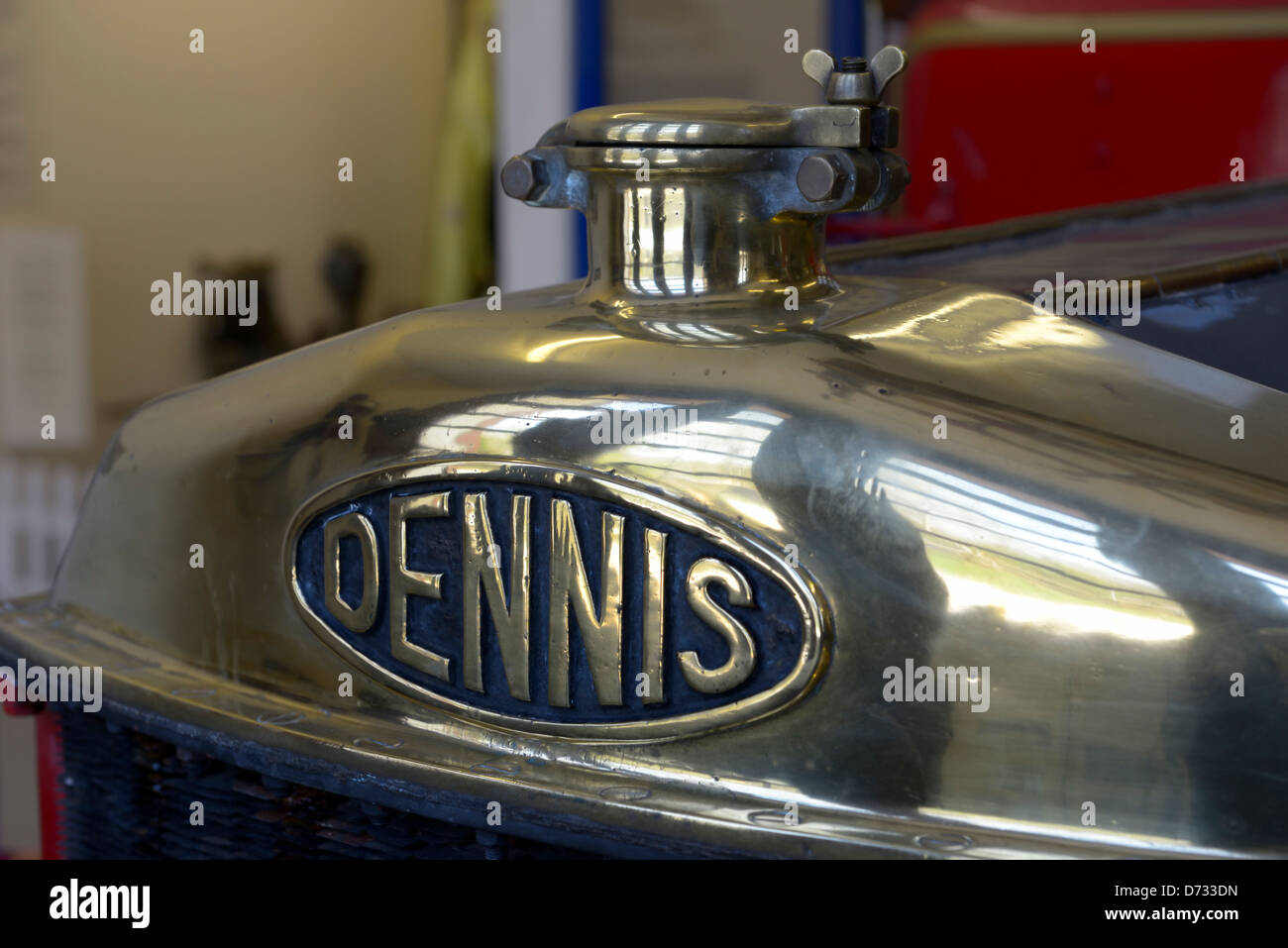 The polished brass bonnet radiator cap of a vintage Dennis fire engine ...